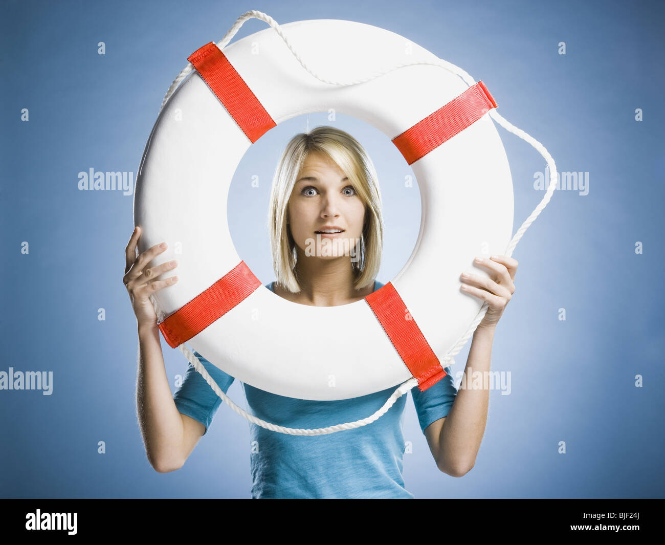 woman looking through a life preserver Stock Photo - Alamy