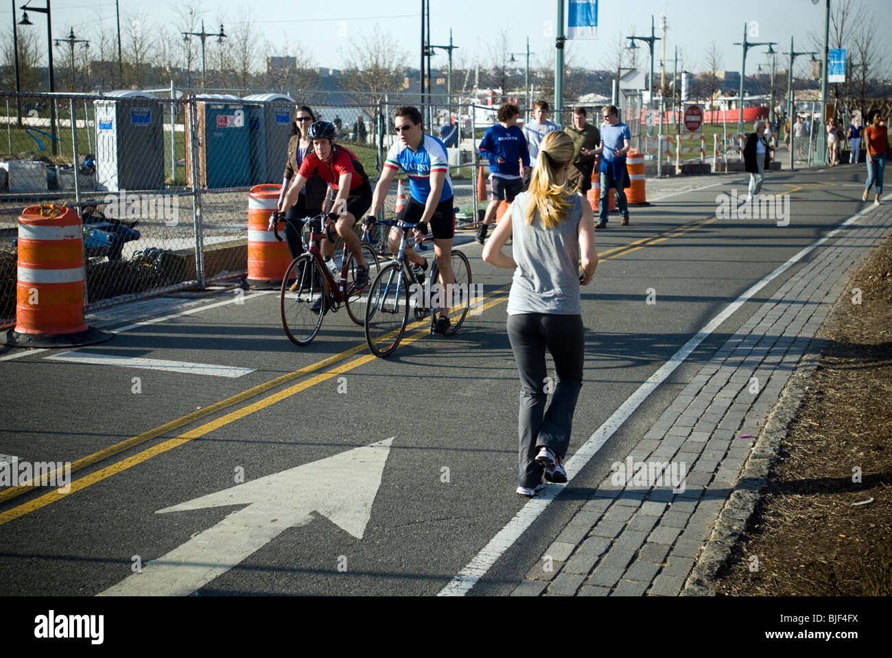 Bicyclists, joggers, and walkers share the pathway in Hudson River Park ...