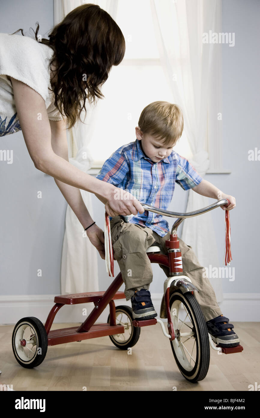 little boy riding a tricycle Stock Photo - Alamy