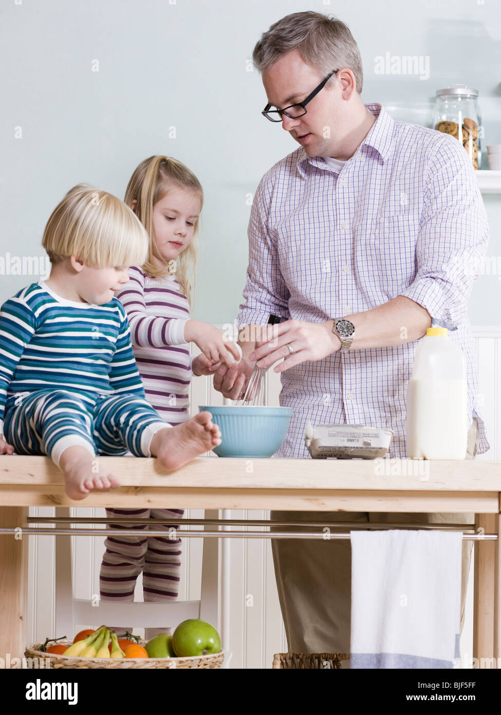 father and children making breakfast Stock Photo - Alamy