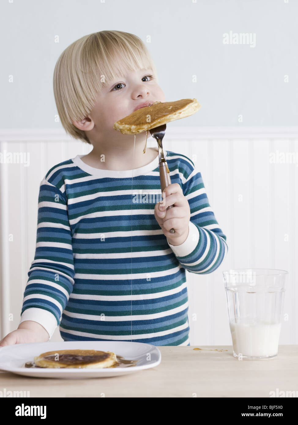 little boy eating breakfast Stock Photo - Alamy