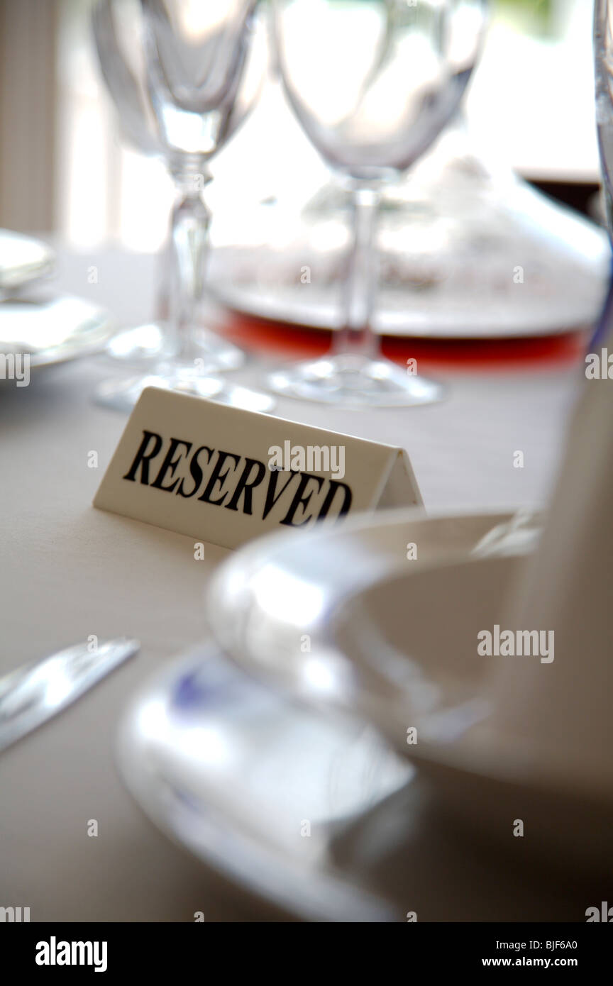 Extreme close up of tableware and reserved sign Stock Photo - Alamy