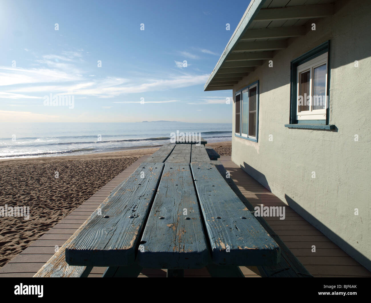 Picnic tables in front of a lifeguard office building Stock Photo - Alamy