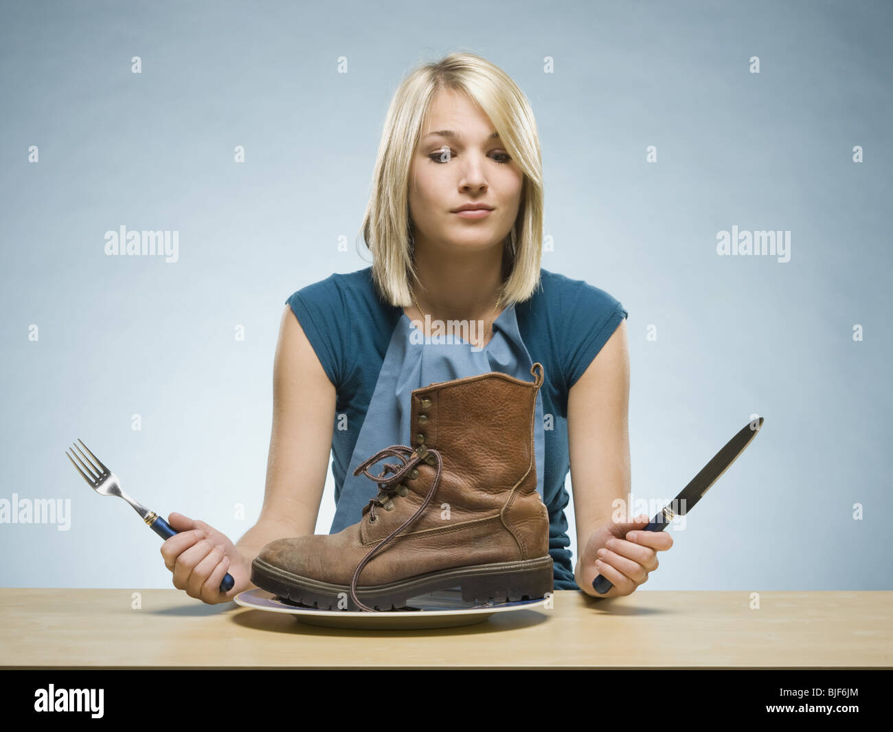 woman eating a boot Stock Photo - Alamy