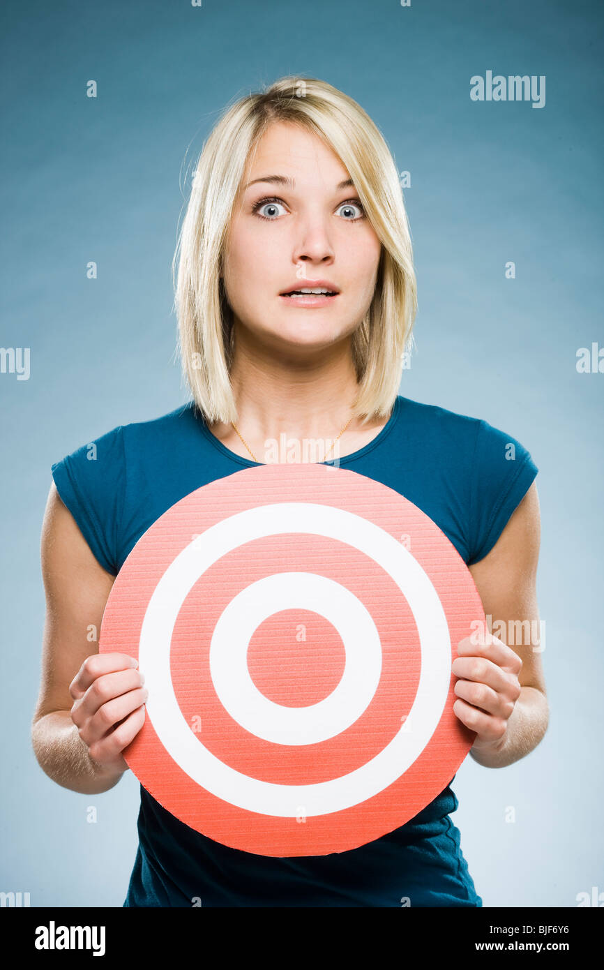 woman holding up a target Stock Photo - Alamy