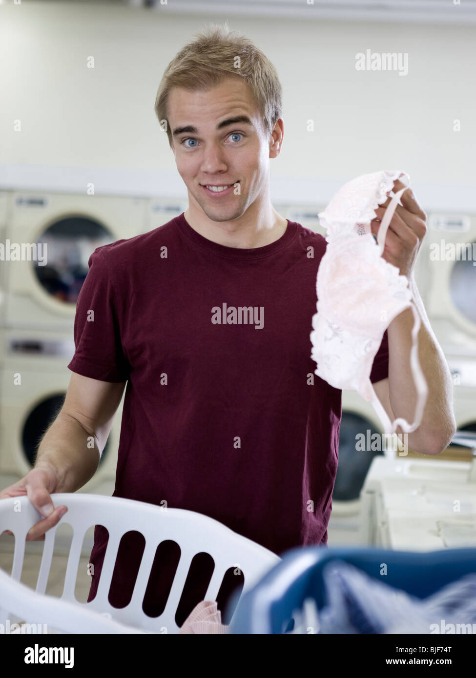 man holding up a bra Stock Photo - Alamy