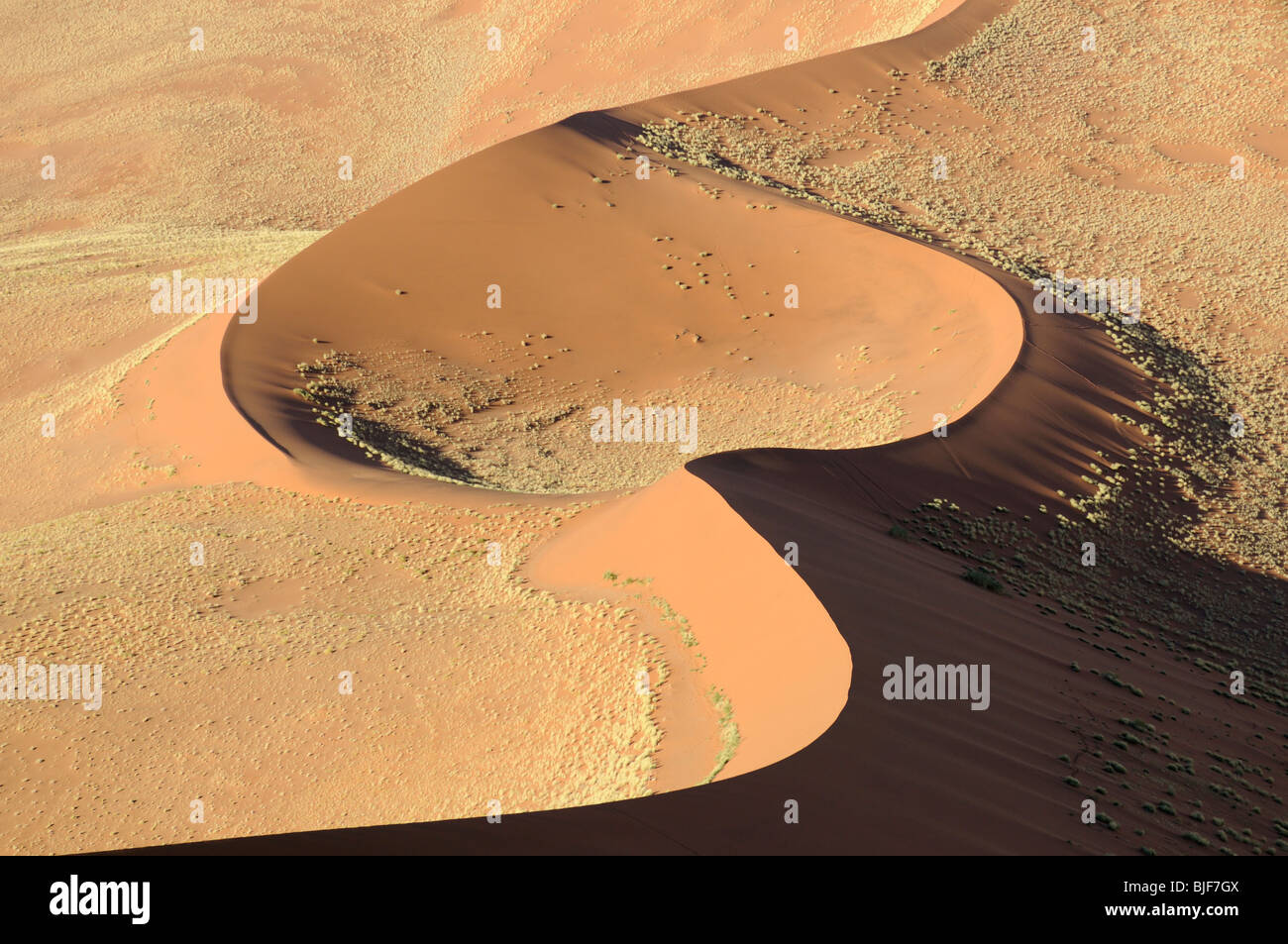 Aerial view from a Microlight aircraft of heart shaped dune, Namibia ...