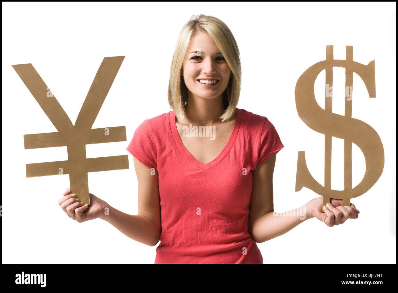 woman holding currency symbols Stock Photo - Alamy