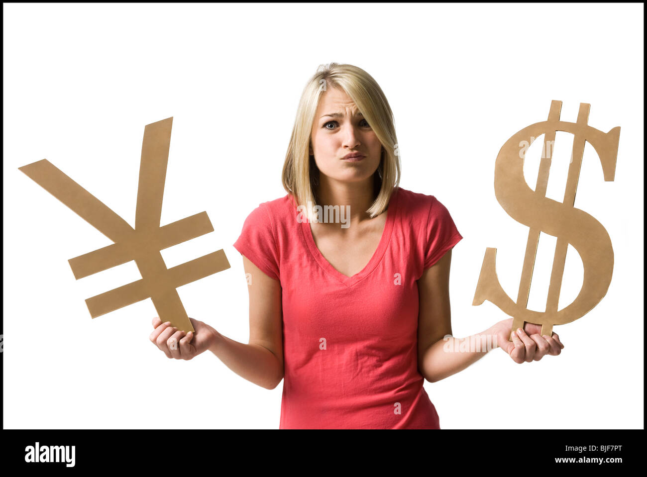 woman holding currency symbols Stock Photo - Alamy