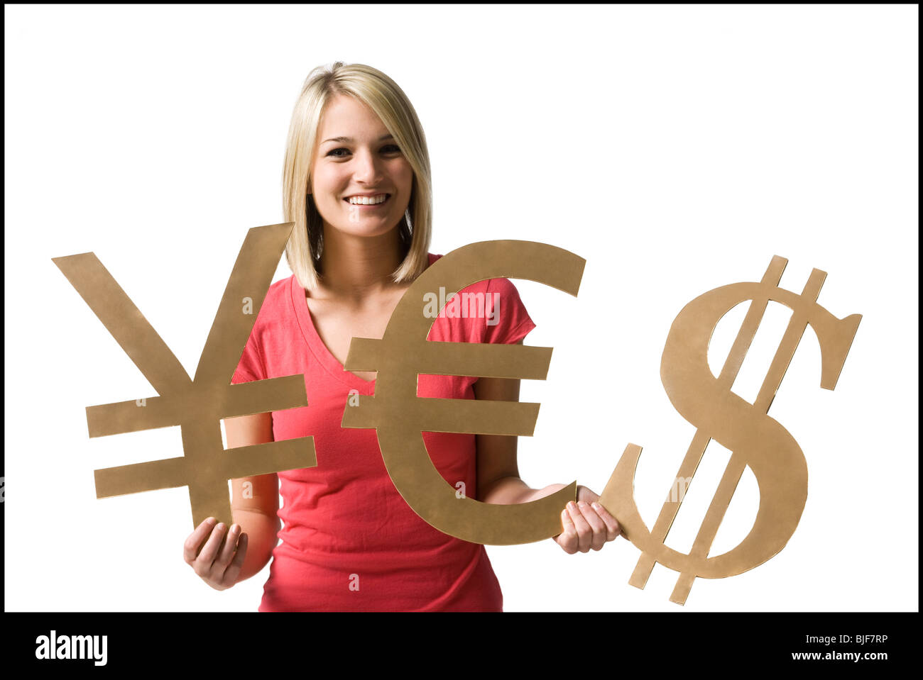 woman holding currency symbols Stock Photo - Alamy