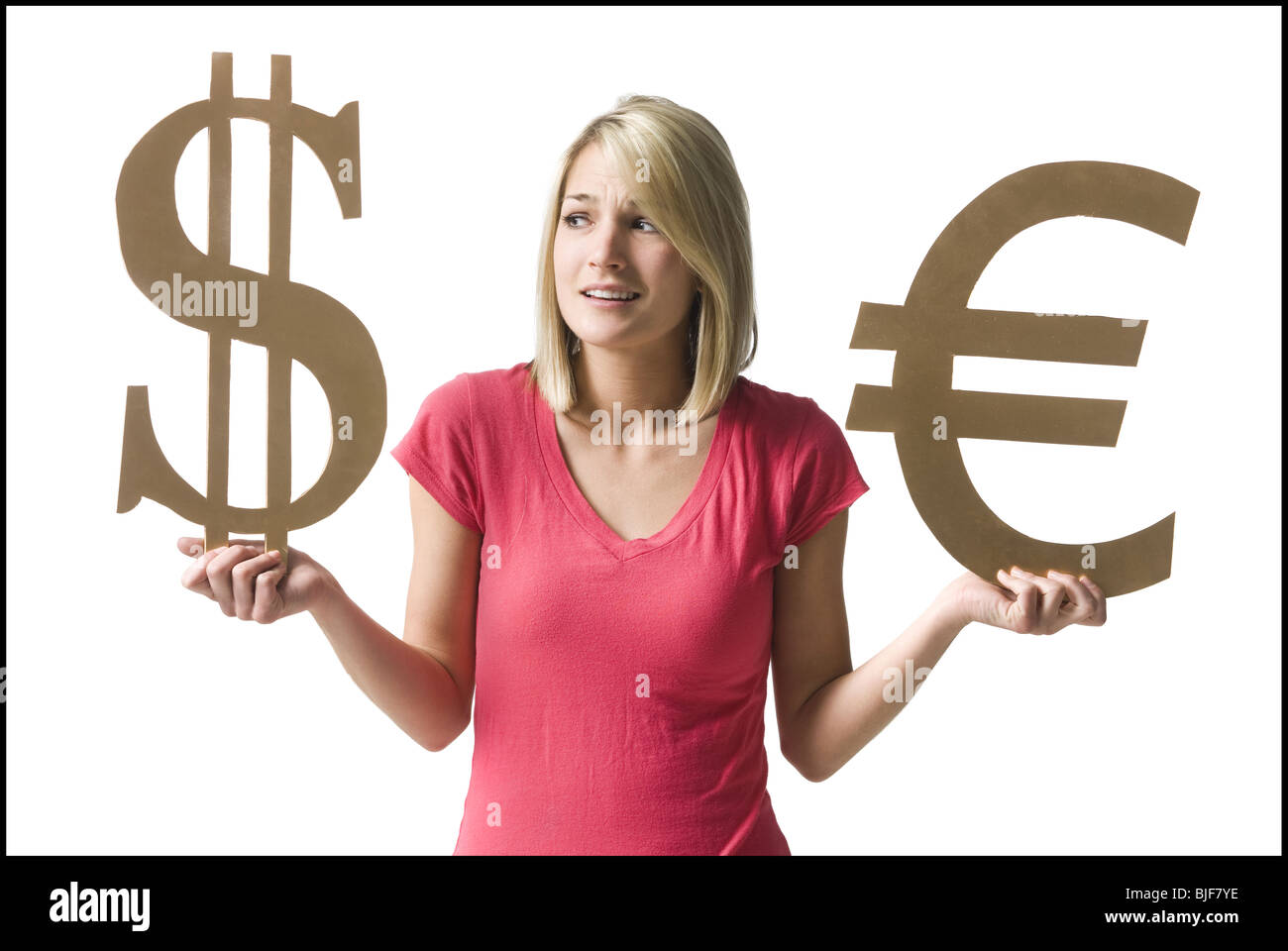 woman holding currency symbols Stock Photo - Alamy