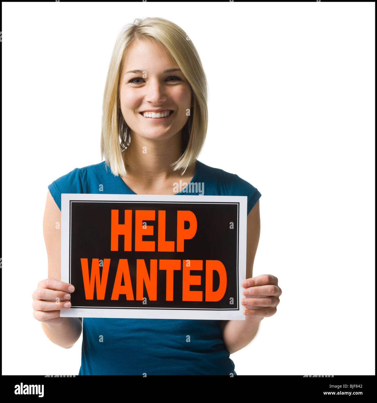 woman holding a help wanted sign Stock Photo - Alamy