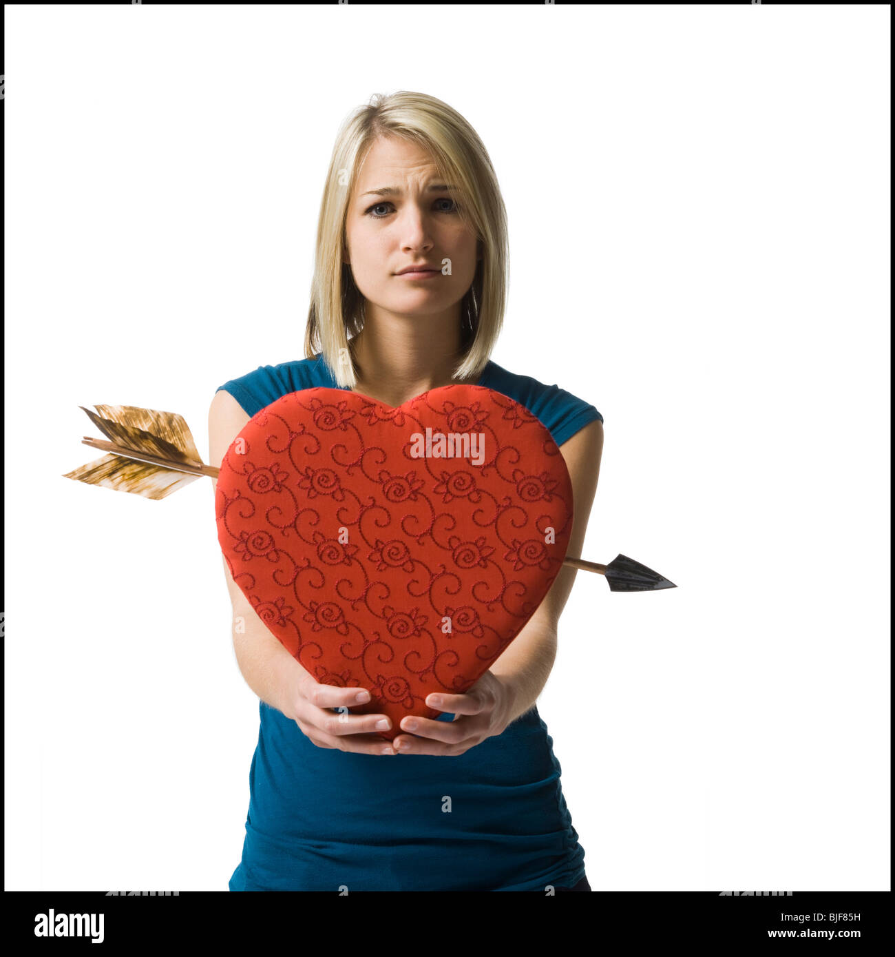 woman holding an oversized red heart Stock Photo - Alamy