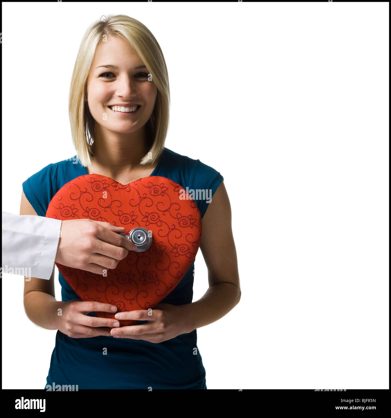woman holding an oversized red heart Stock Photo - Alamy