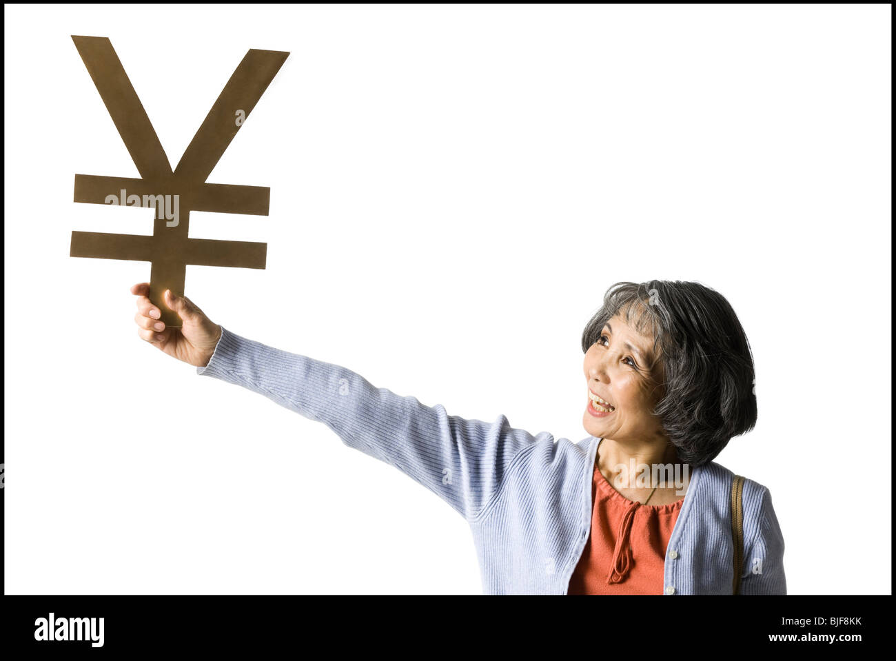 woman holding currency symbol Stock Photo - Alamy