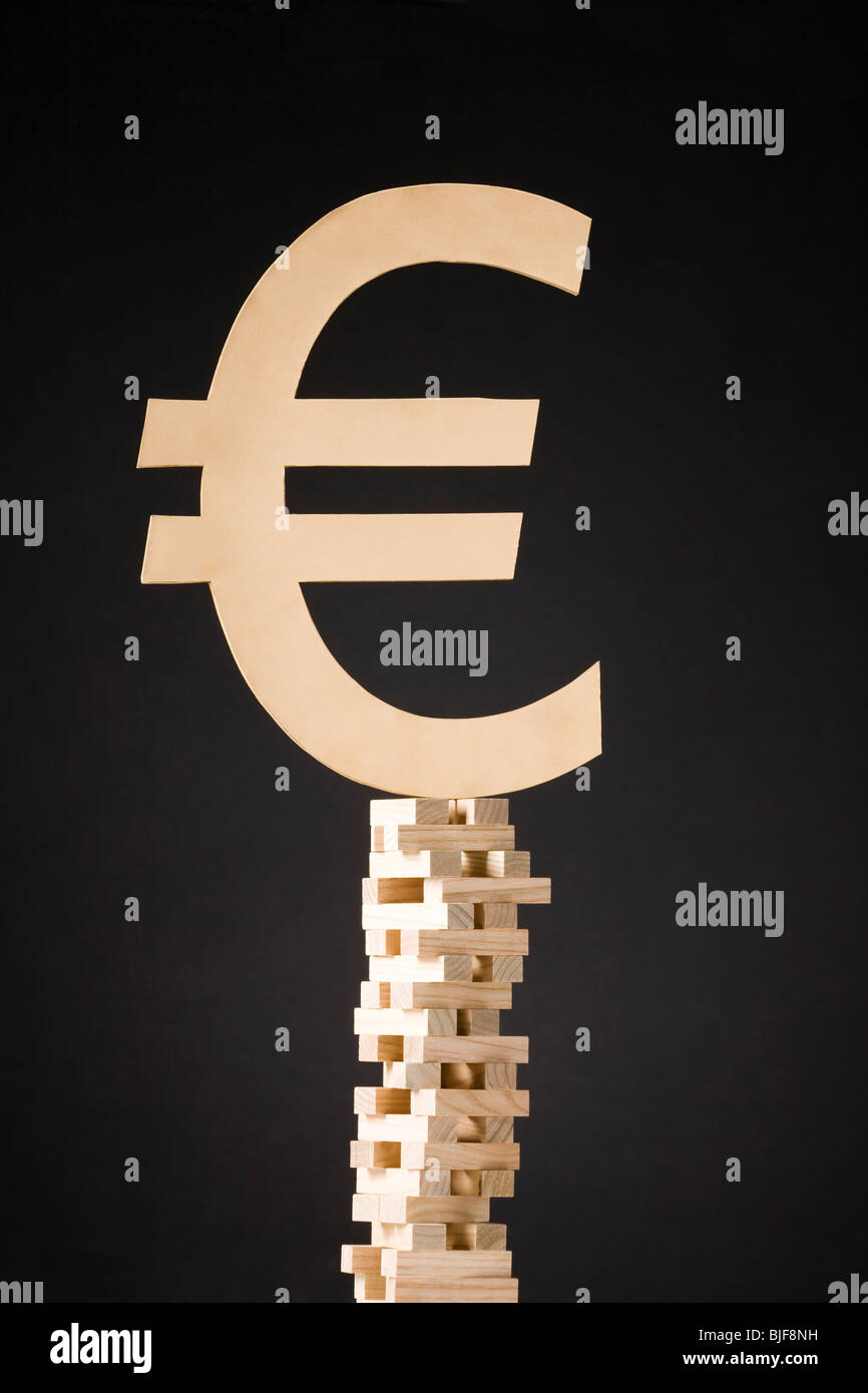 currency symbol on a tower of blocks Stock Photo - Alamy