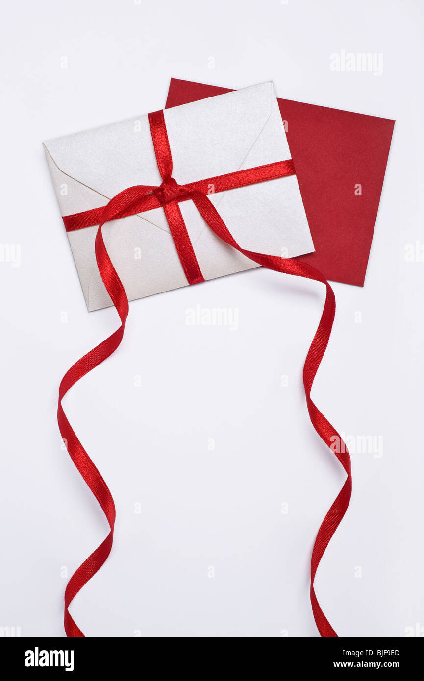 envelopes with red ribbon isolated on white background Stock Photo - Alamy