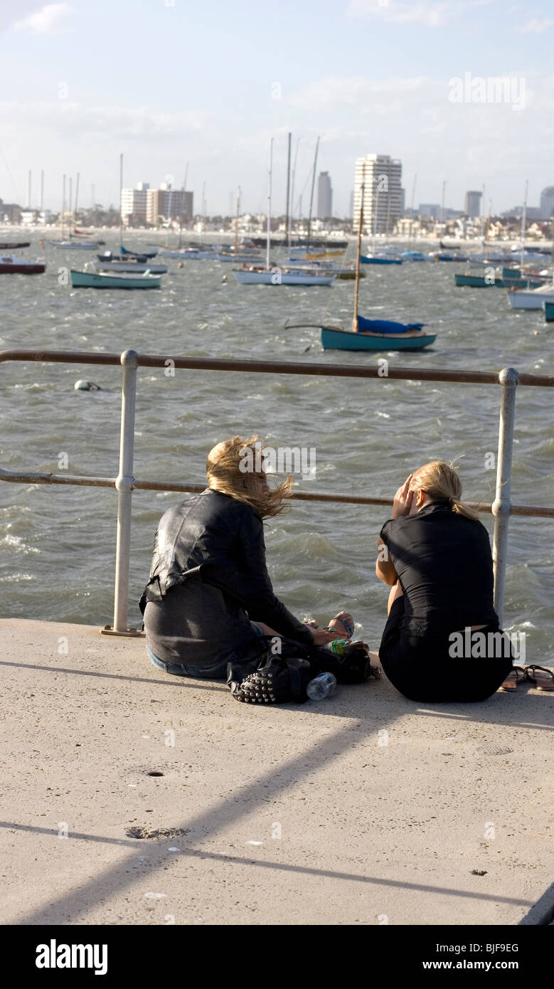Two girls talking two boats hi-res stock photography and images - Alamy