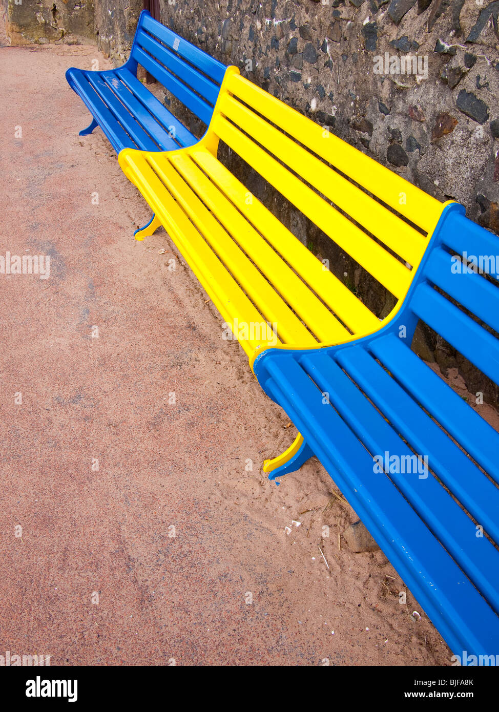 Blue and Yellow Park Benches Stock Photo - Alamy