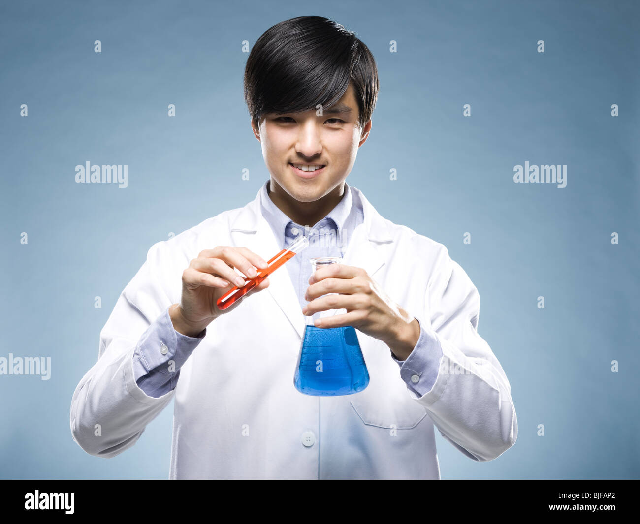 Scientist holding up two test tubes hi-res stock photography and images ...