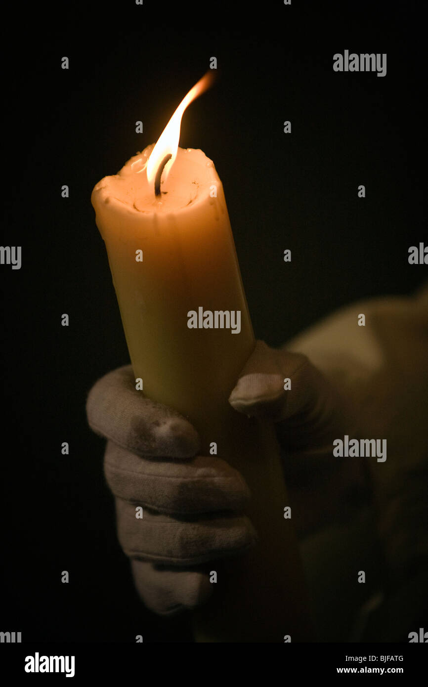 a hand supports a candle of holy week, Spain Stock Photo - Alamy