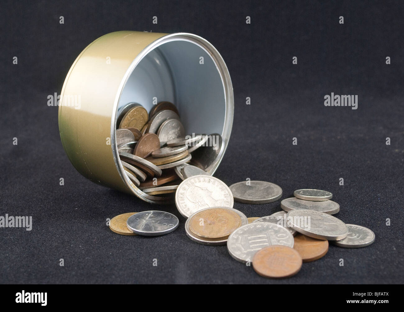 can with coins Stock Photo - Alamy