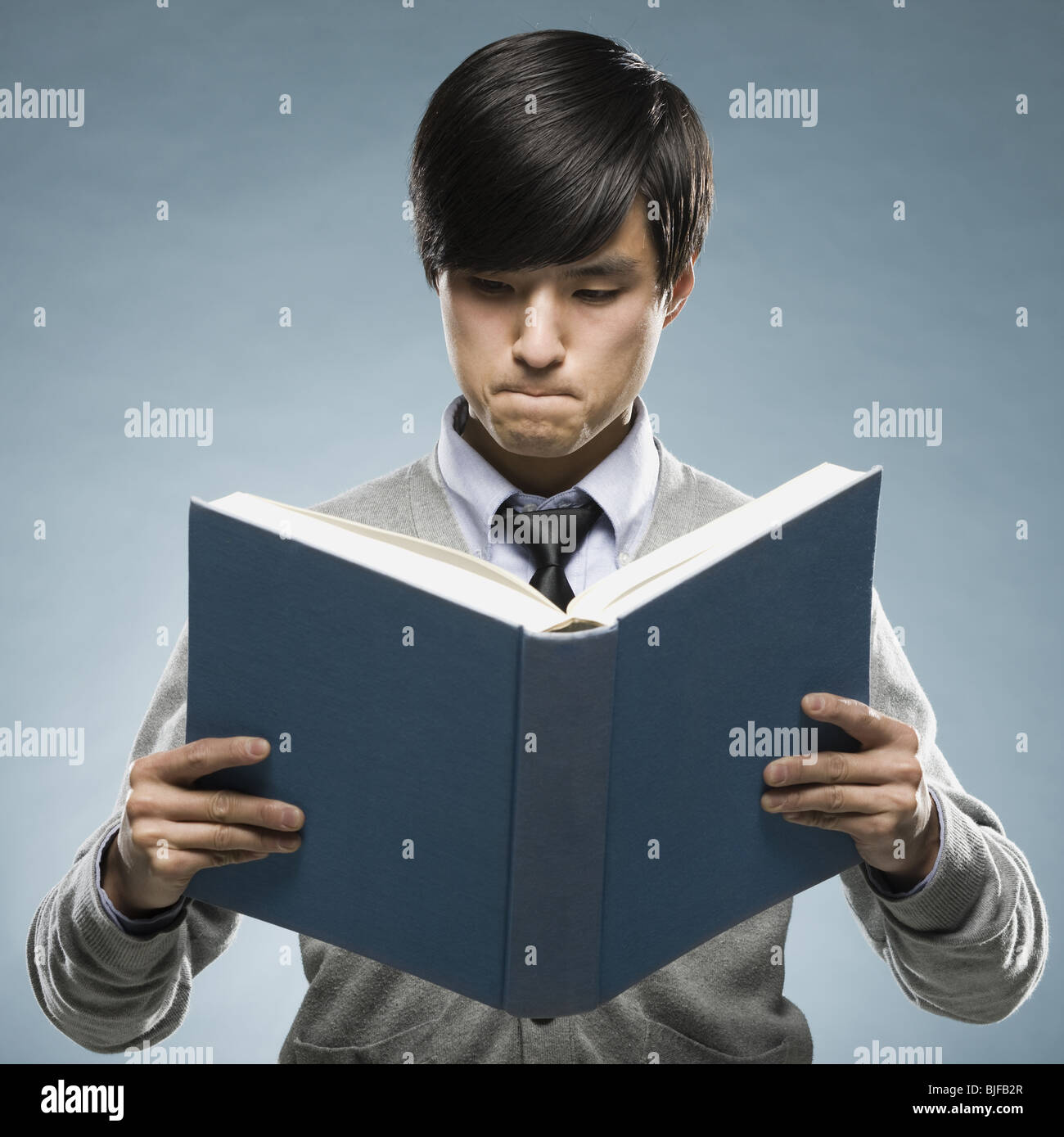 man reading a book Stock Photo - Alamy