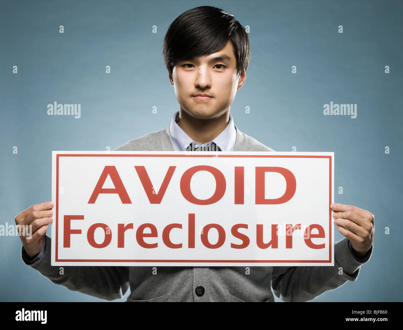 Man holding sign hi-res stock photography and images - Alamy