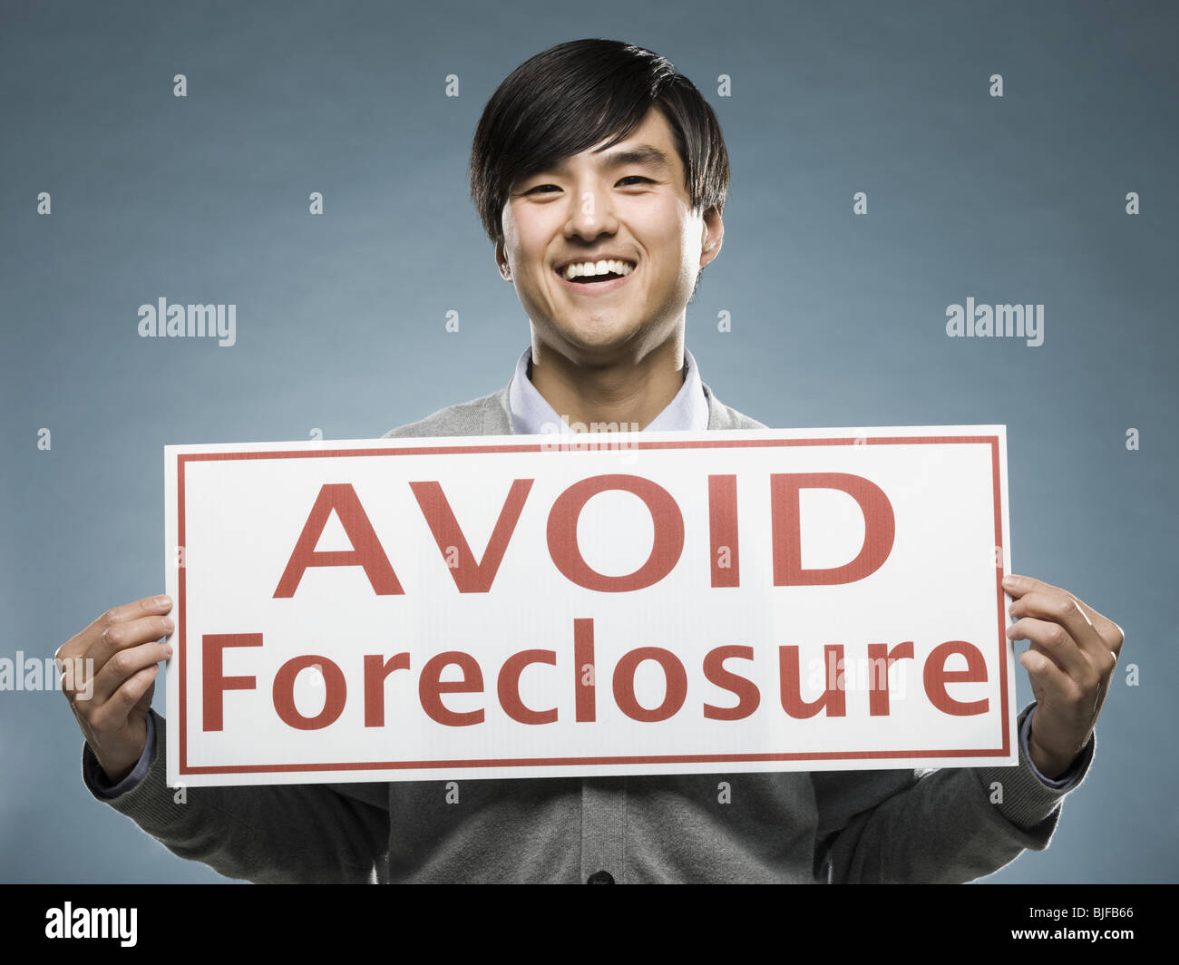 Man holding sign hi-res stock photography and images - Alamy