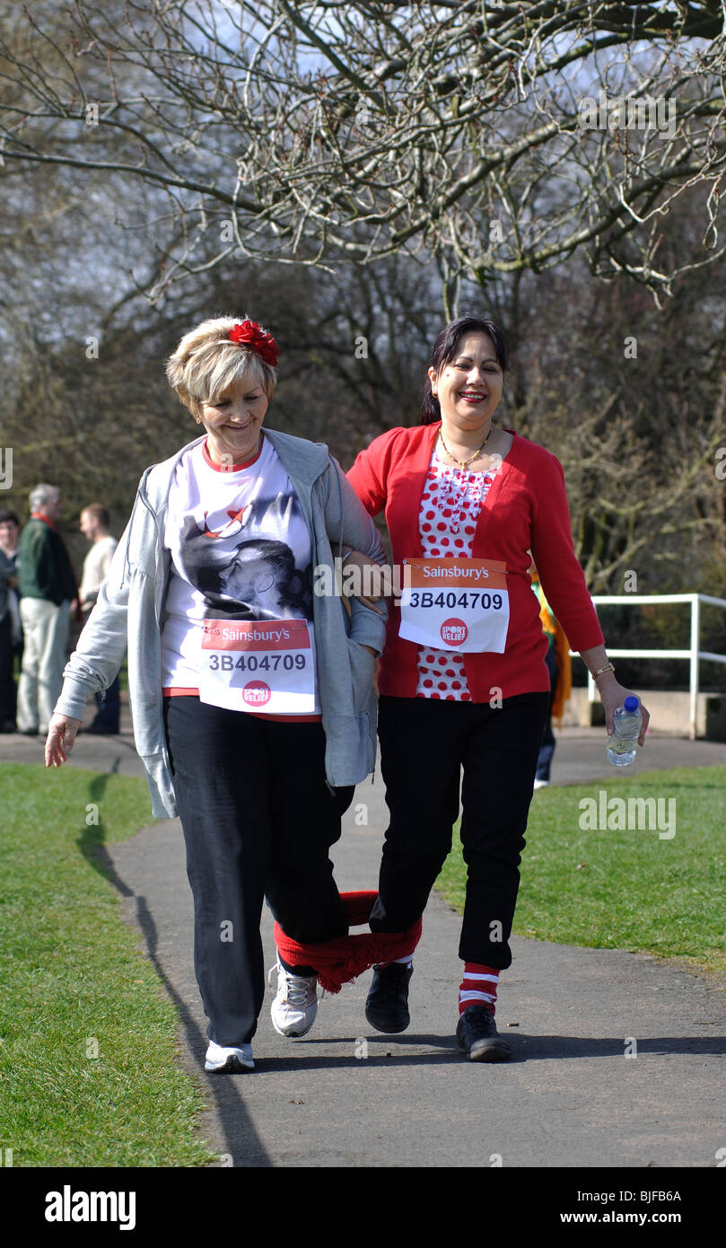 Three-legged walkers in the Sport Relief Mile, Warwick, UK Stock Photo ...