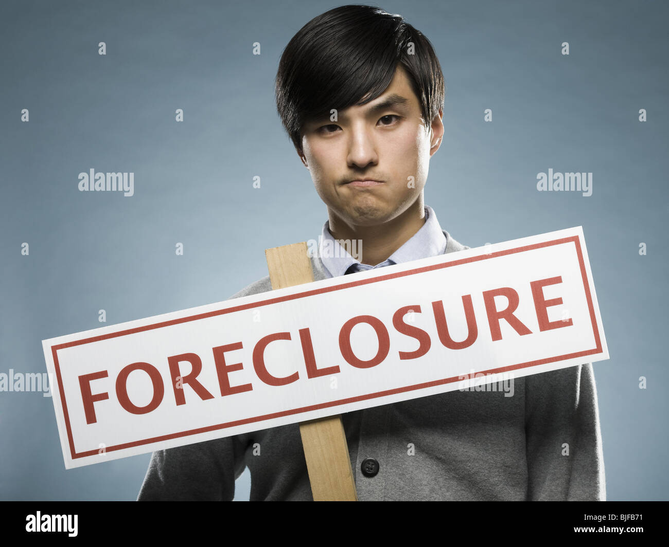 Man holding sign hi-res stock photography and images - Alamy