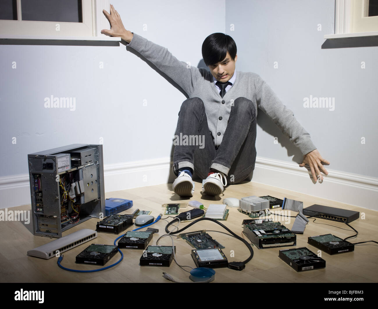 Man in surrounded computer parts hi-res stock photography and images ...