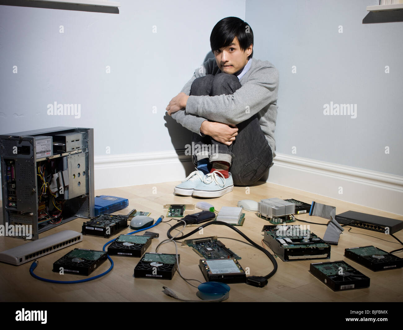 Man in surrounded computer parts hi-res stock photography and images ...