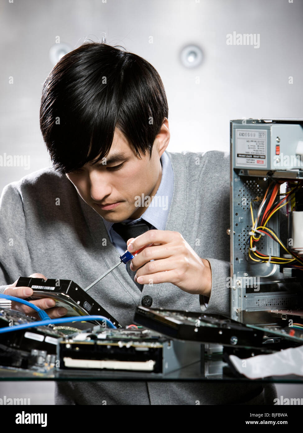 man working on a computer Stock Photo - Alamy