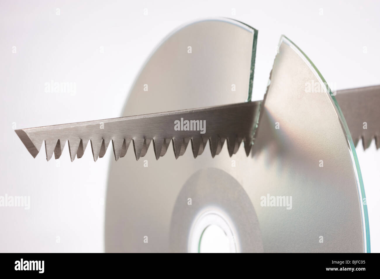 saw cutting a cd Stock Photo - Alamy