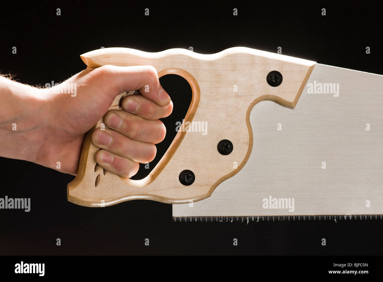 hand holding a saw Stock Photo - Alamy