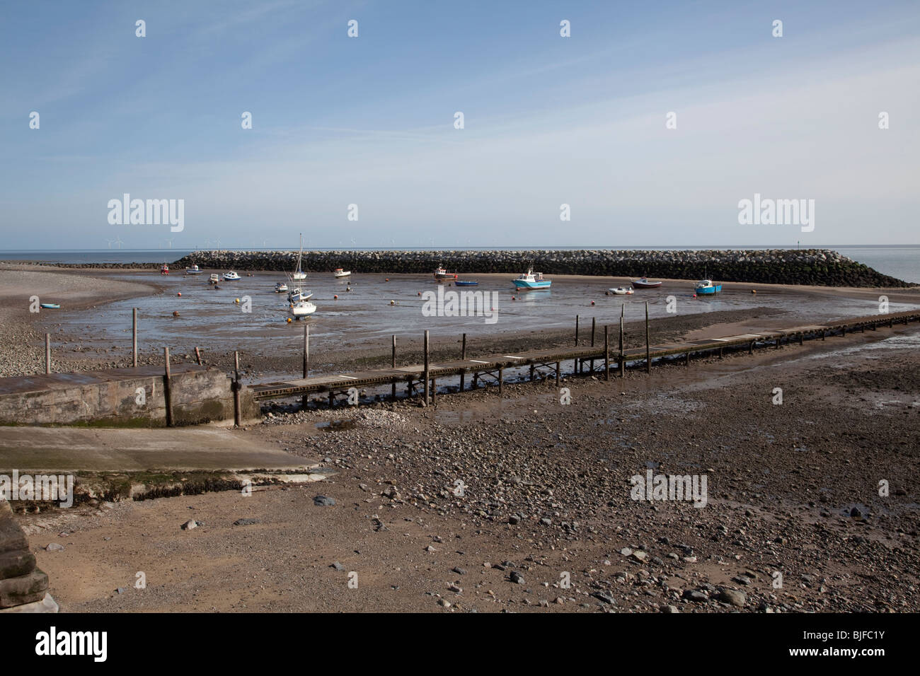 Man made harbour with small boats during low tide at Rhos on Sea ...