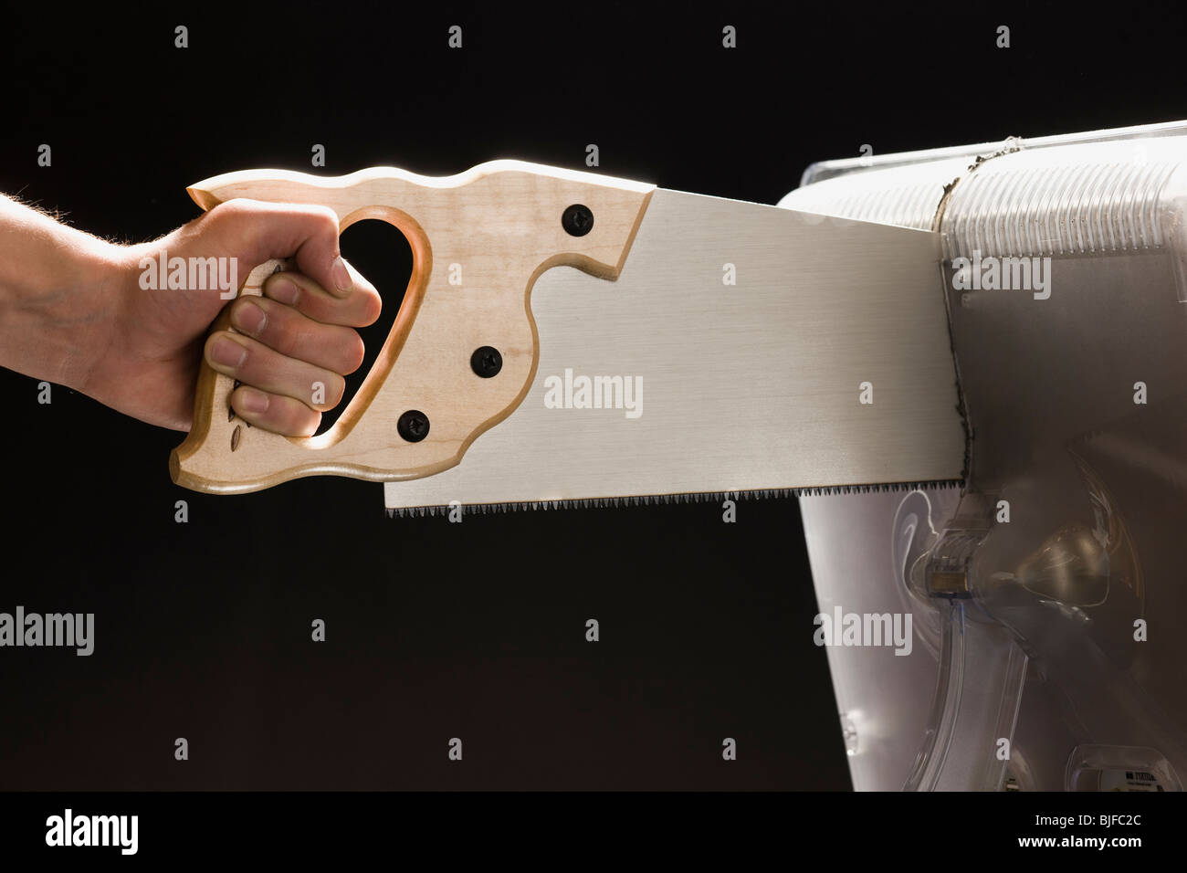 saw cutting a computer monitor Stock Photo - Alamy