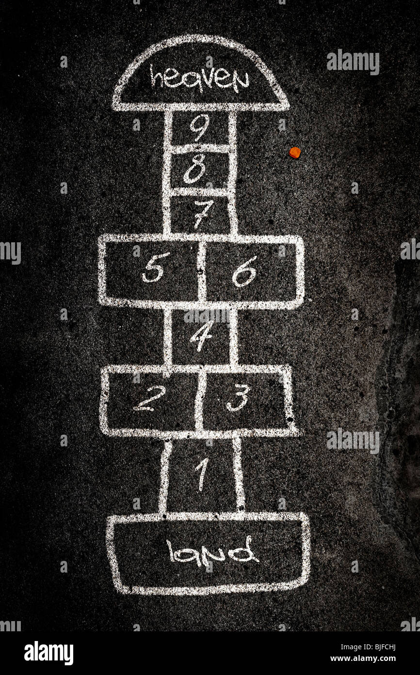 Hopscotch game designed on the road with chalk Stock Photo - Alamy