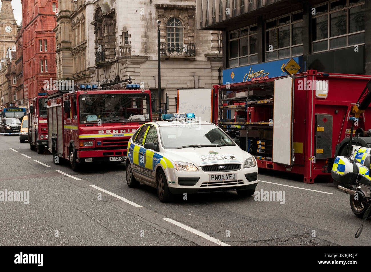 Fire engines and police car at scene of accident Stock Photo - Alamy