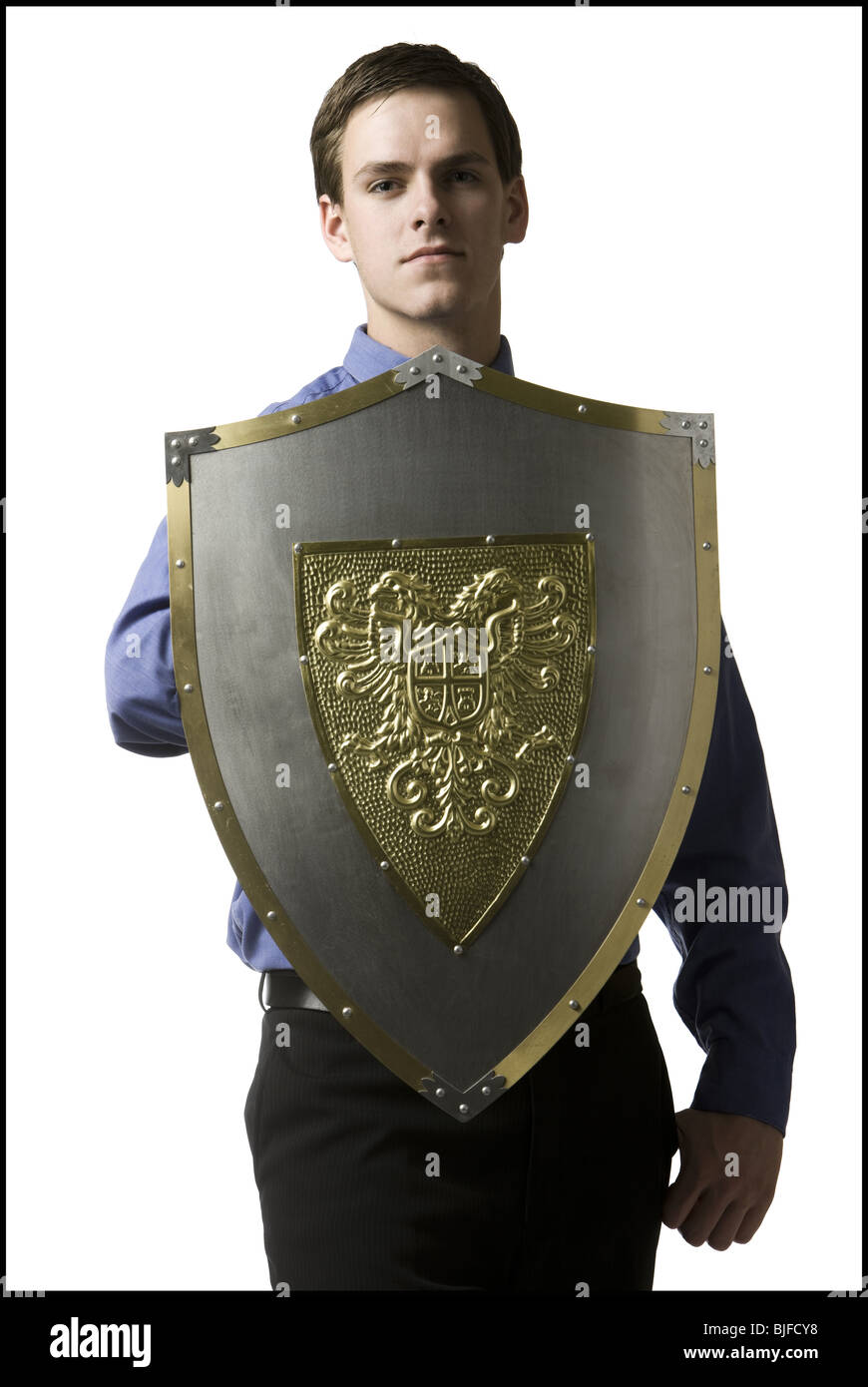businessman holding a shield Stock Photo - Alamy