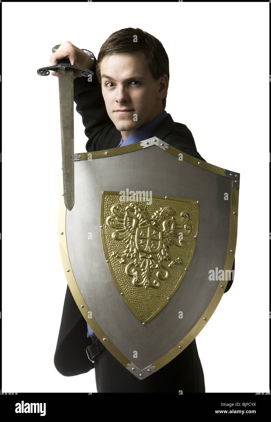 businessman holding a sword and shield Stock Photo - Alamy