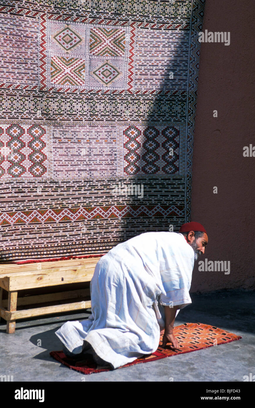 MOROCCO MUSLIM MAN PRAYING IN THE MARRAKESH MEDINA OLD TOWN Stock Photo ...
