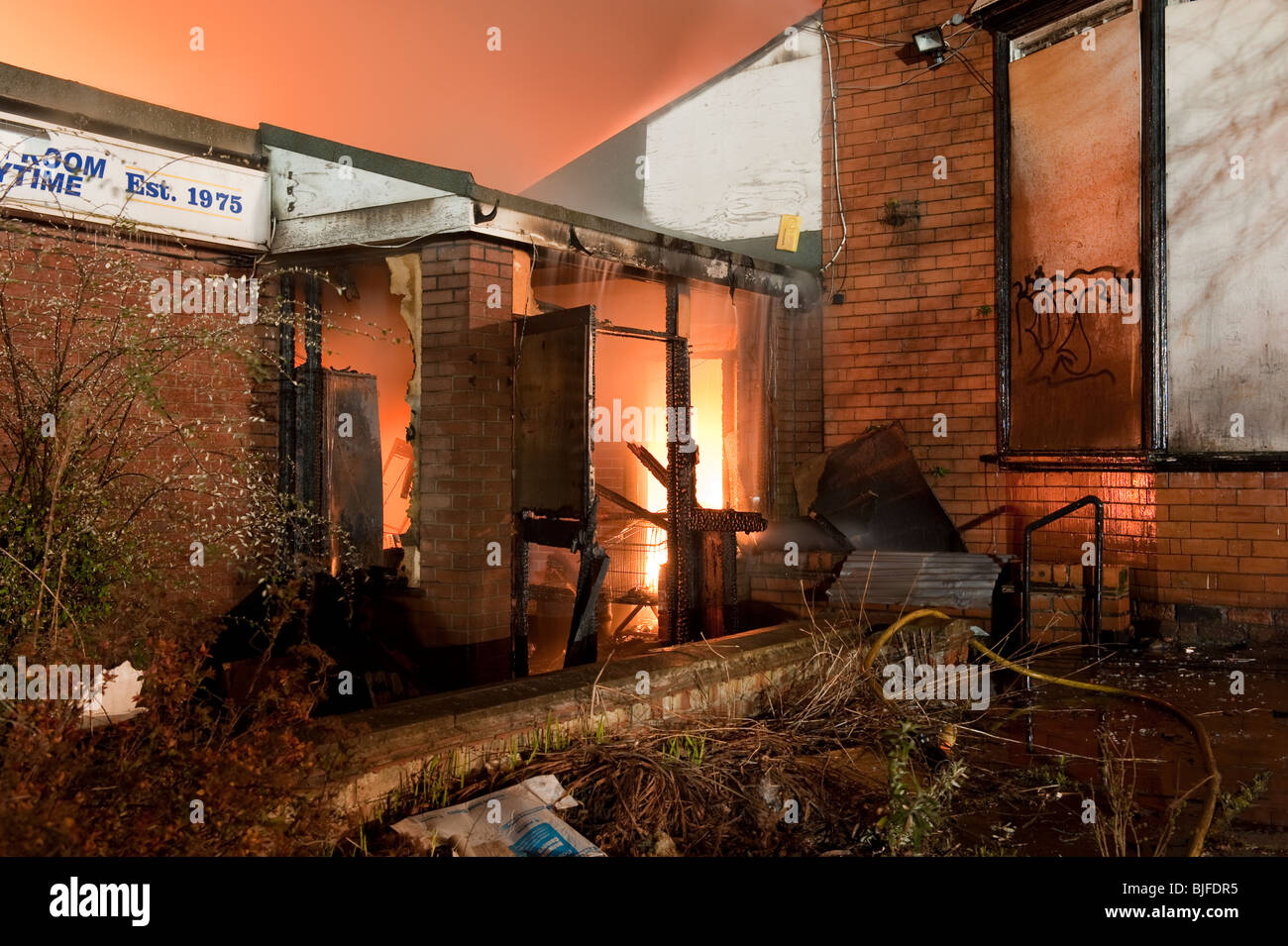 Recreational club on fire at night Stock Photo - Alamy