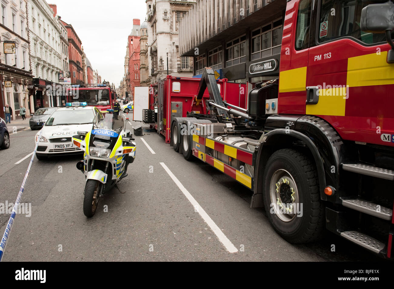 Fire engine and police motorbike and police car Stock Photo - Alamy