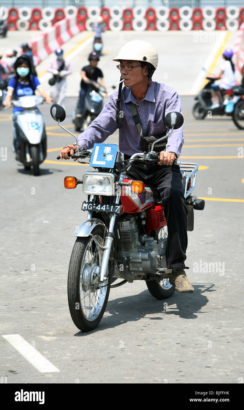 Driving school motocyclists macao china hi-res stock photography and ...