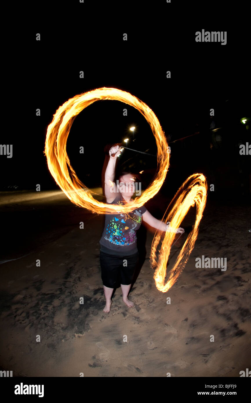 FIRE TWIRLING ON MOOLOOLABA BEACH Stock Photo - Alamy
