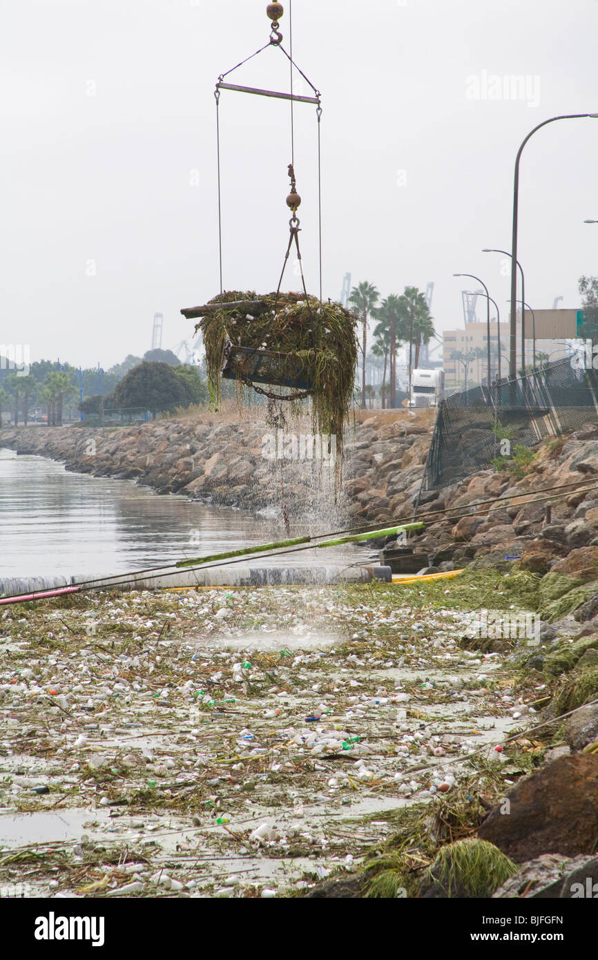 Cranes picking up garbage debris after first rain of the season from ...
