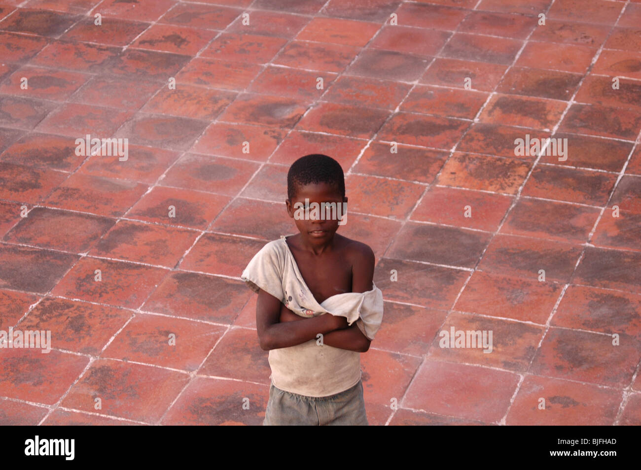 A young African boy has his picture taken. Ilha De Mocambique ...