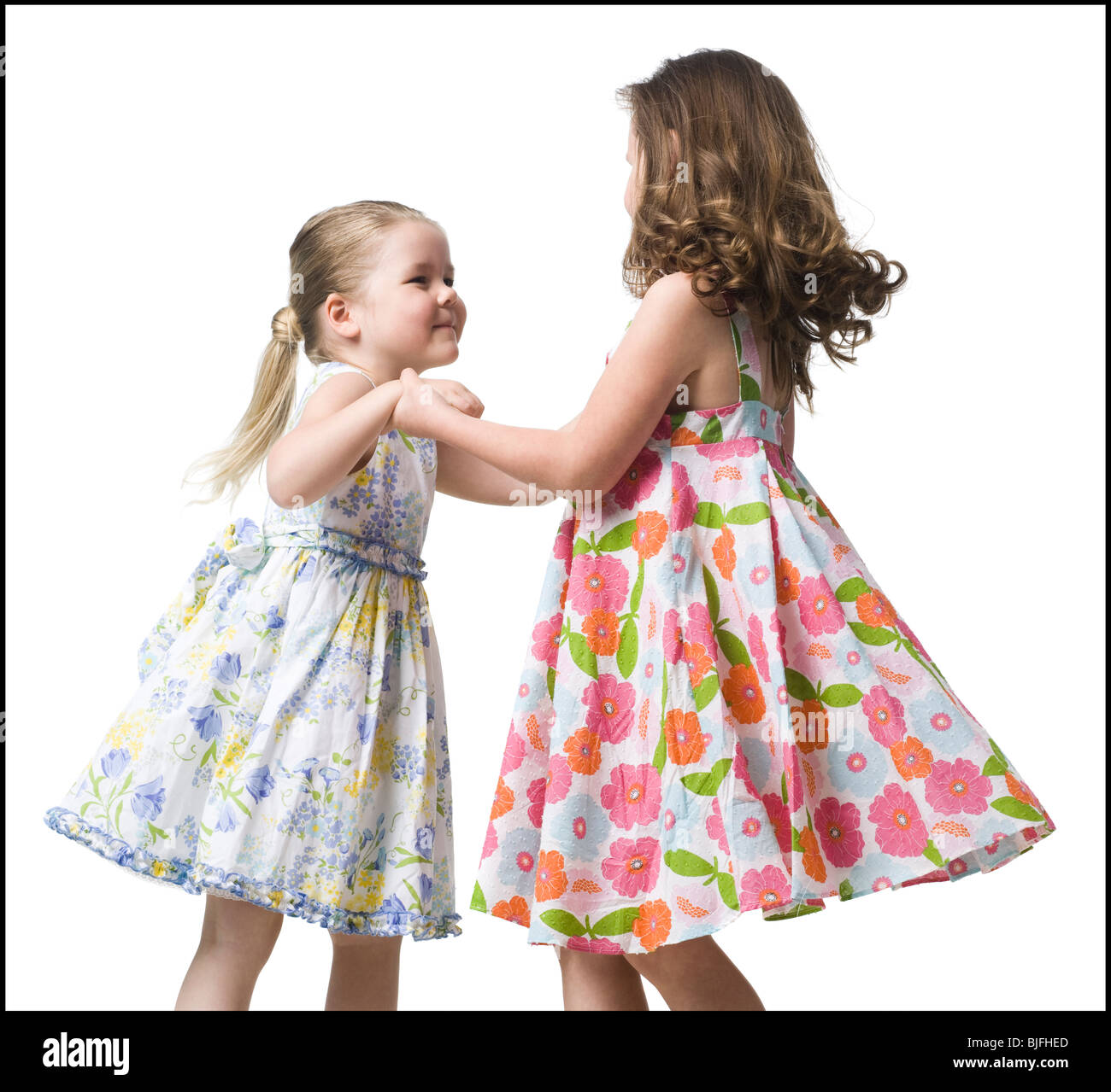 two girls dancing in dresses Stock Photo - Alamy